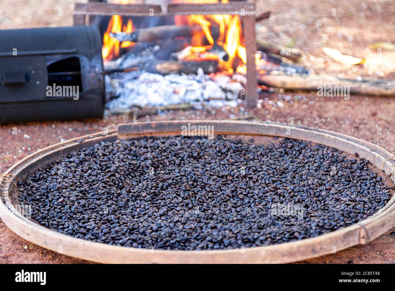 roasting coffee the old farm way, manual roaster, wood fire Stock Photo ...