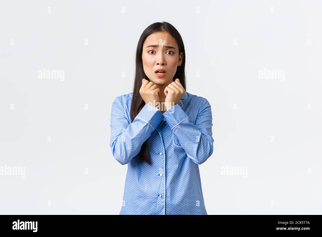 Scared timid asian girl panicking, looking anxious and afraid ...