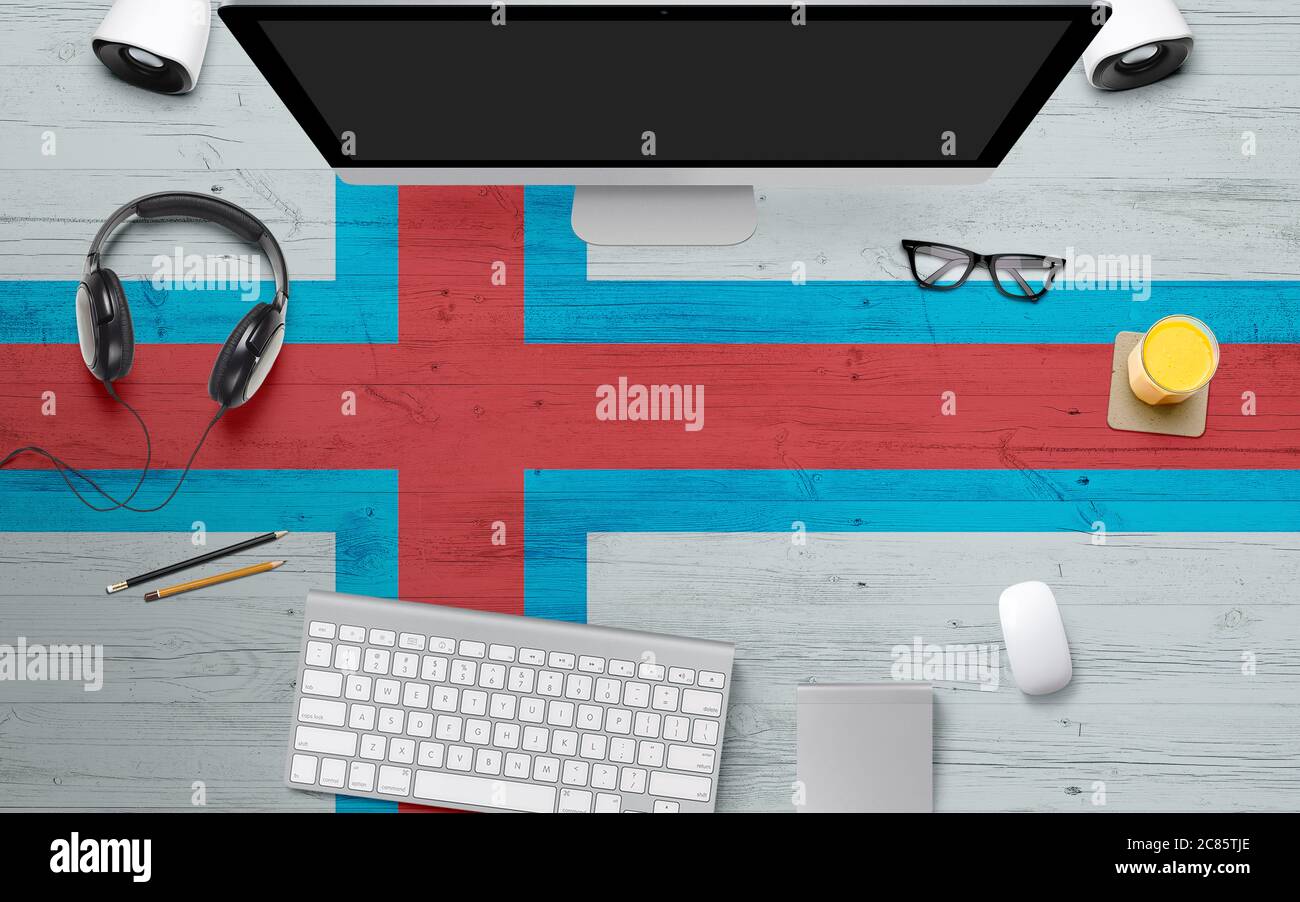 Faroe Islands flag background with headphone,computer keyboard and ...