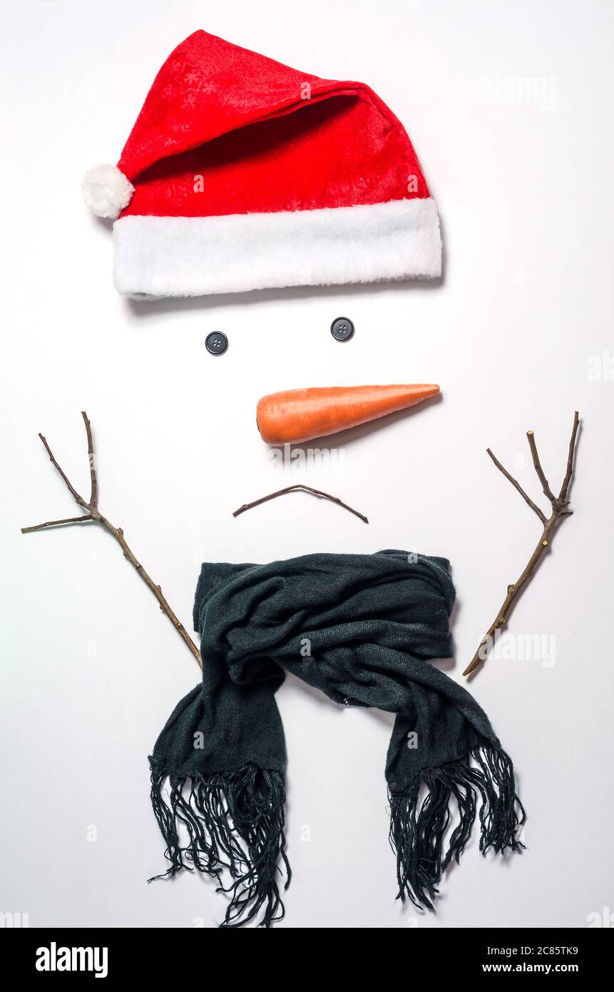 The face of a sad snowman on a white background. A set of items for ...