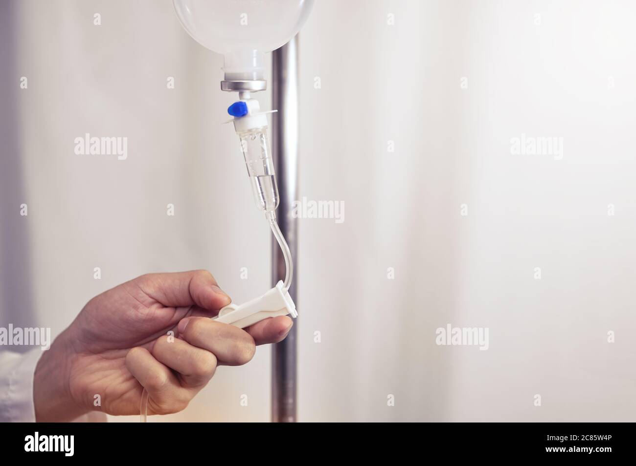 Doctor adjusted volume rate of saline IV drip Infusion intravenous ...
