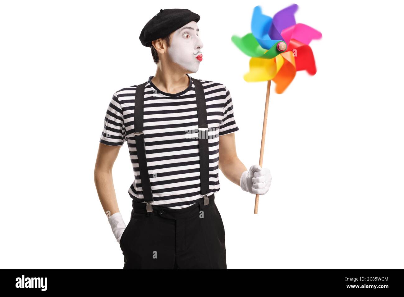 Mime blowing a pinwheel isolated on white background Stock Photo - Alamy