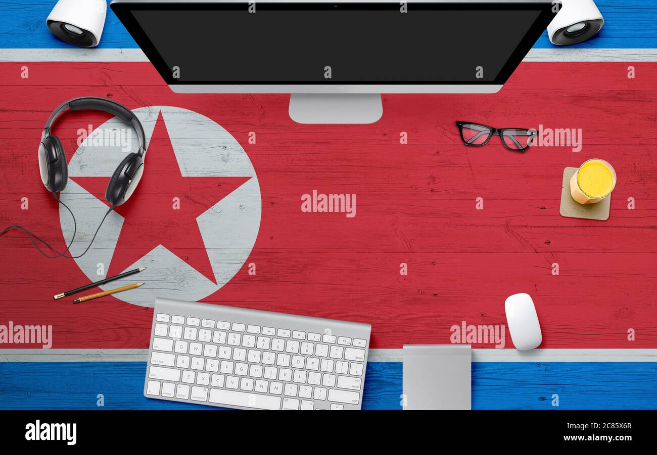 North Korea flag background with headphone,computer keyboard and mouse ...