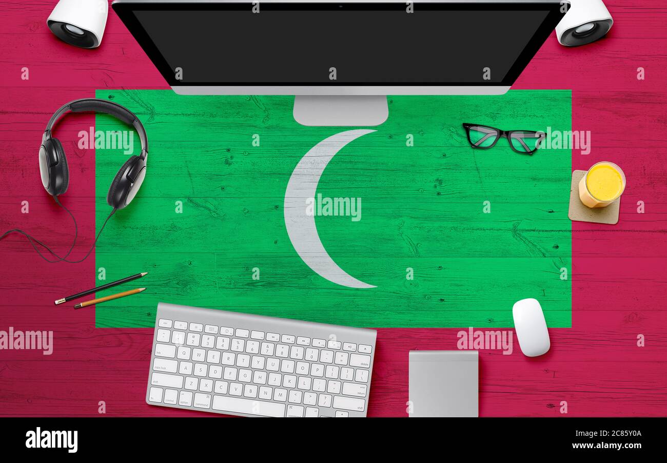 Maldives flag background with headphone,computer keyboard and mouse on ...