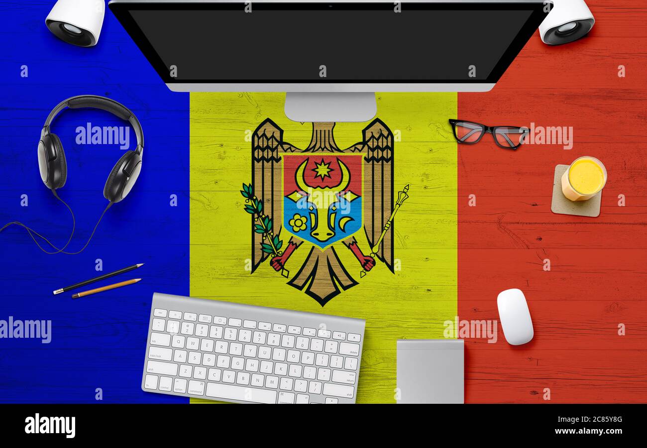 Moldova flag background with headphone,computer keyboard and mouse on ...