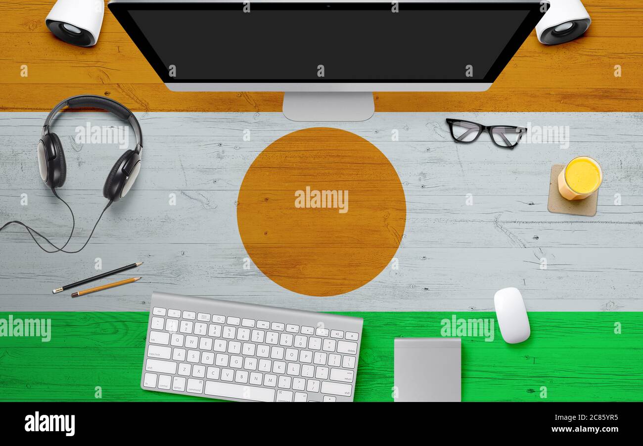 Niger flag background with headphone,computer keyboard and mouse on ...
