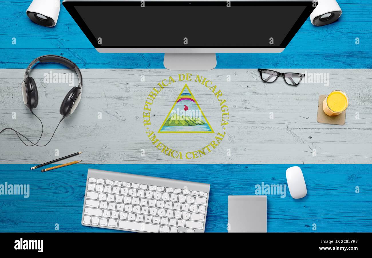 Nicaragua flag background with headphone,computer keyboard and mouse on ...