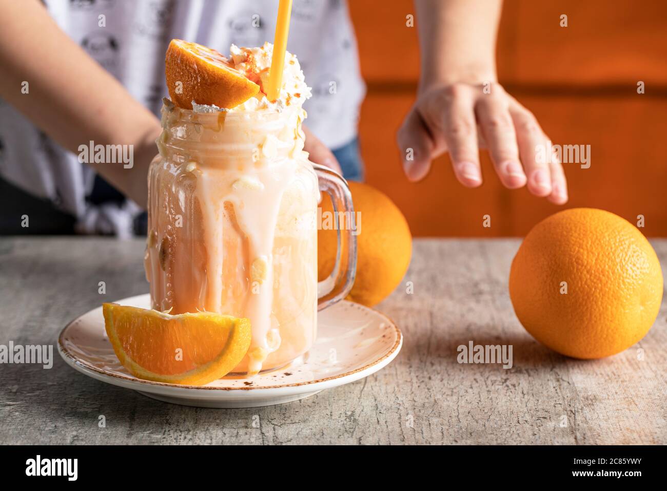 Summer milky cocktail with orange juice Stock Photo - Alamy
