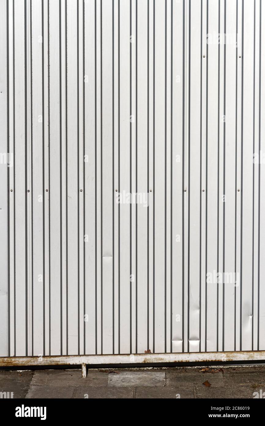 Old rusty metal warehouse wall. Architecture detail background. Metal ...