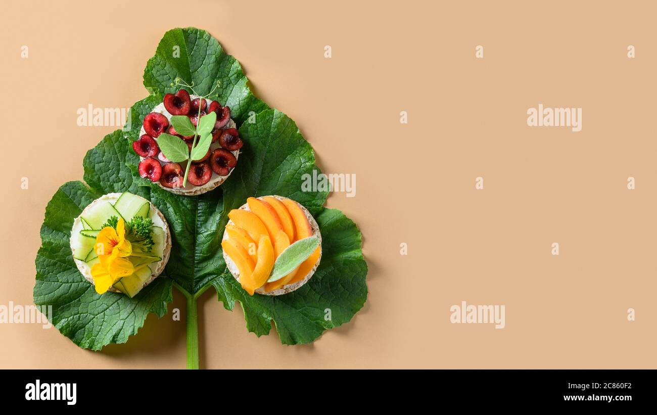 Puffed rice cakes with different toppings friuts and vegetables on ...