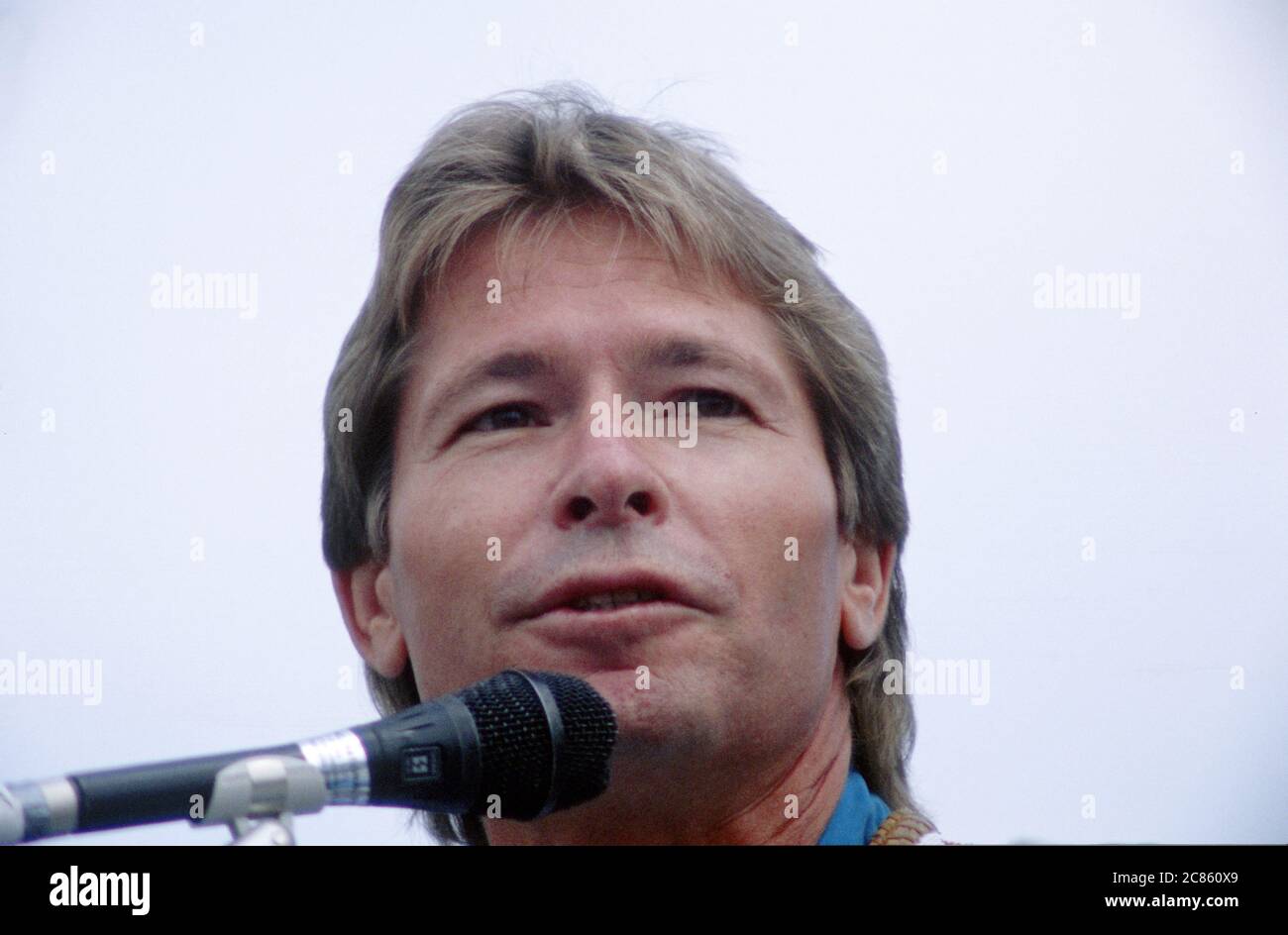 Singer John Denver performs at an Earth Day rally at the United States ...