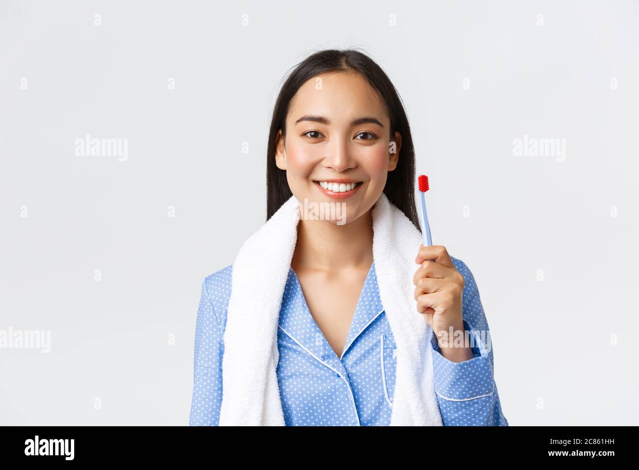 Daily routine, morning and hygiene concept. Pretty asian girl in blue ...