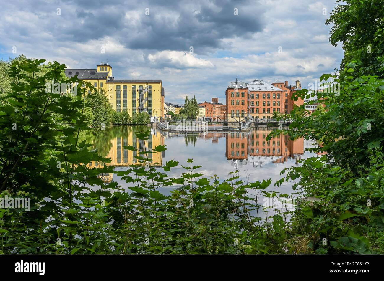 The old industrial landscape and Motala river viewed from city park ...
