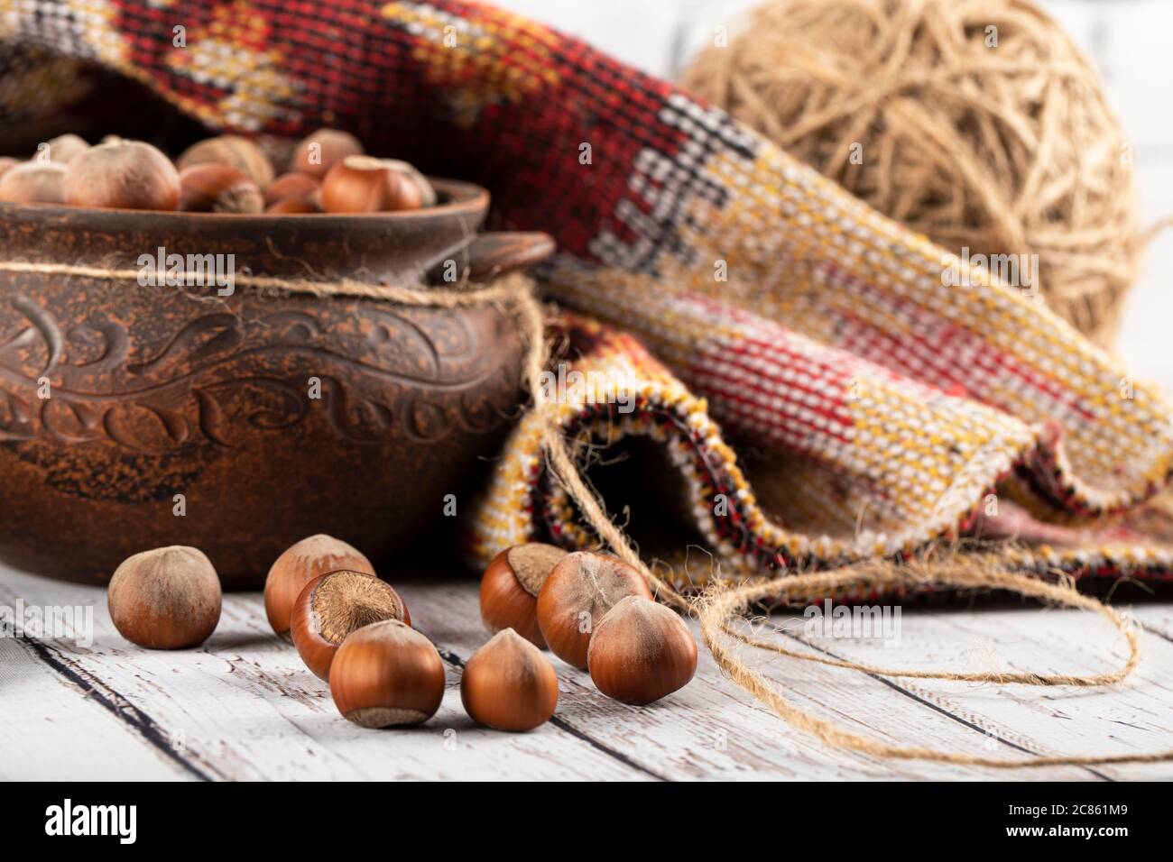 Nuts in an ethnic decorative pot Stock Photo - Alamy