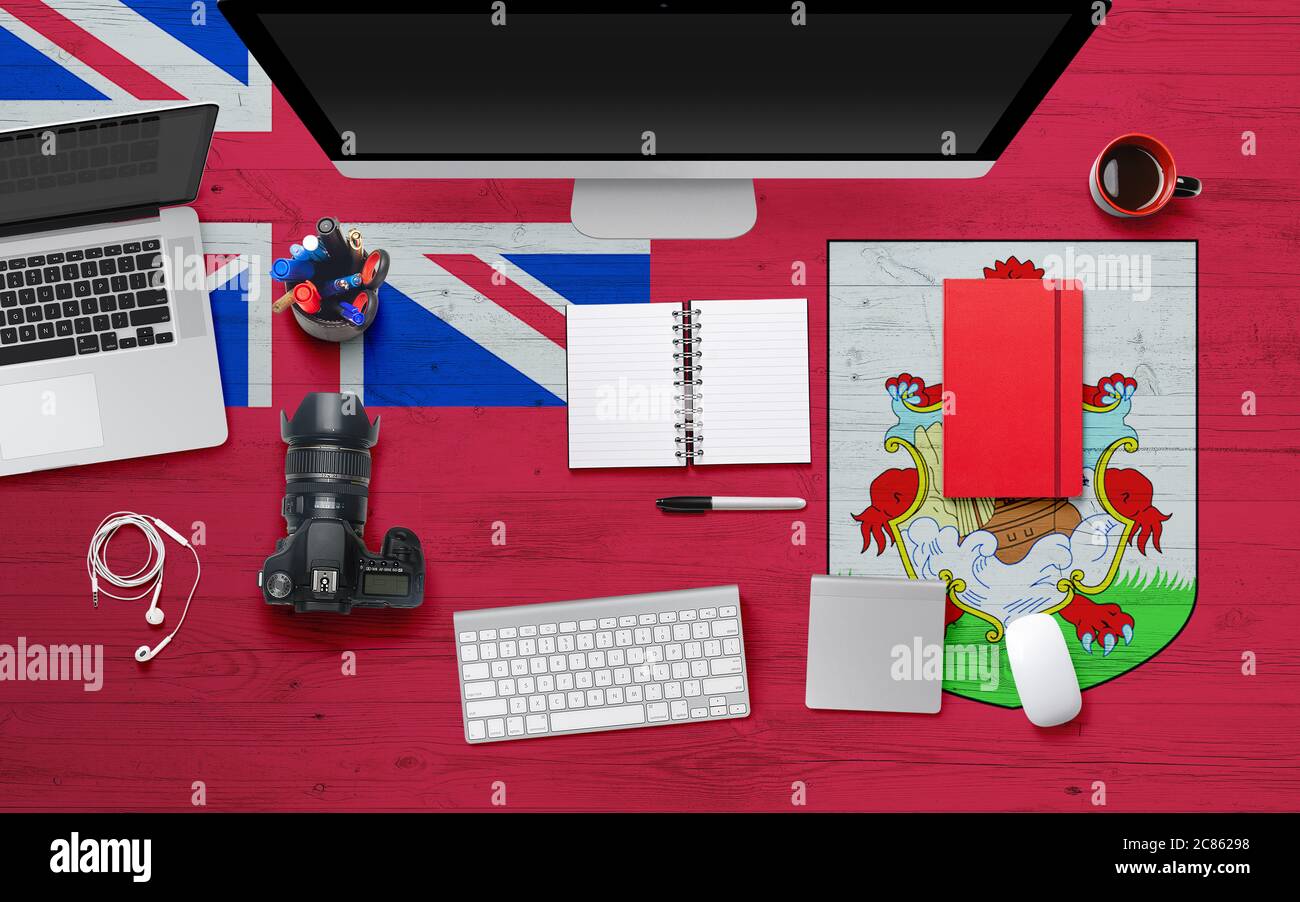 Bermuda flag background with headphone,camera, notebook and mouse on ...