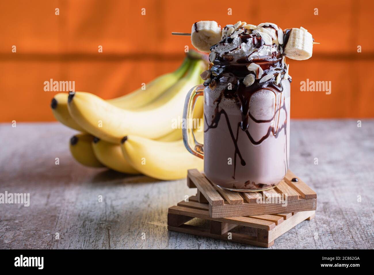 milky cocktail with banana and chocolate syrup Stock Photo - Alamy