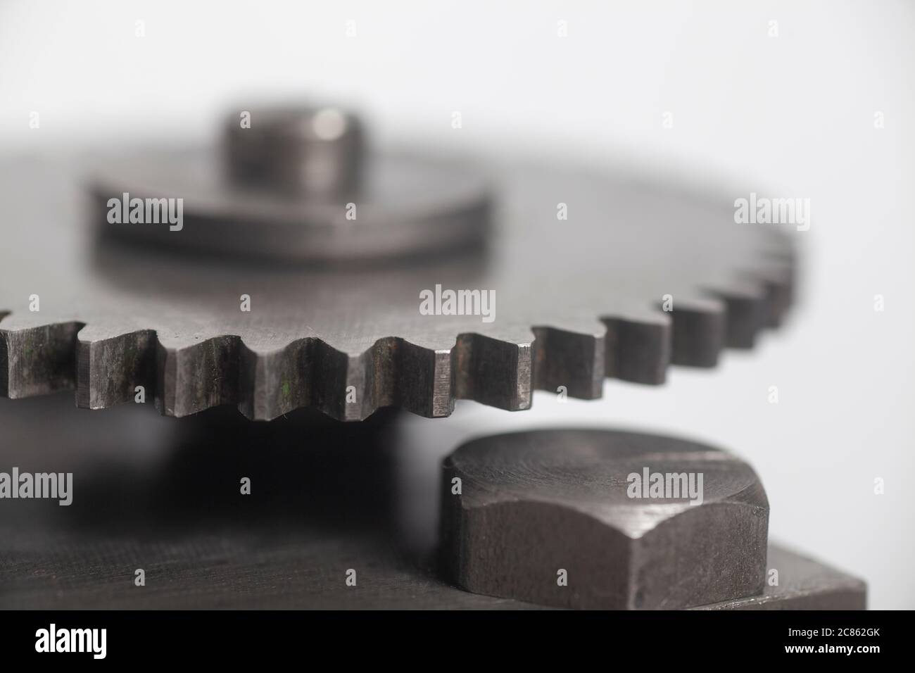 Machine gear, metal cogwheels, on white Stock Photo - Alamy