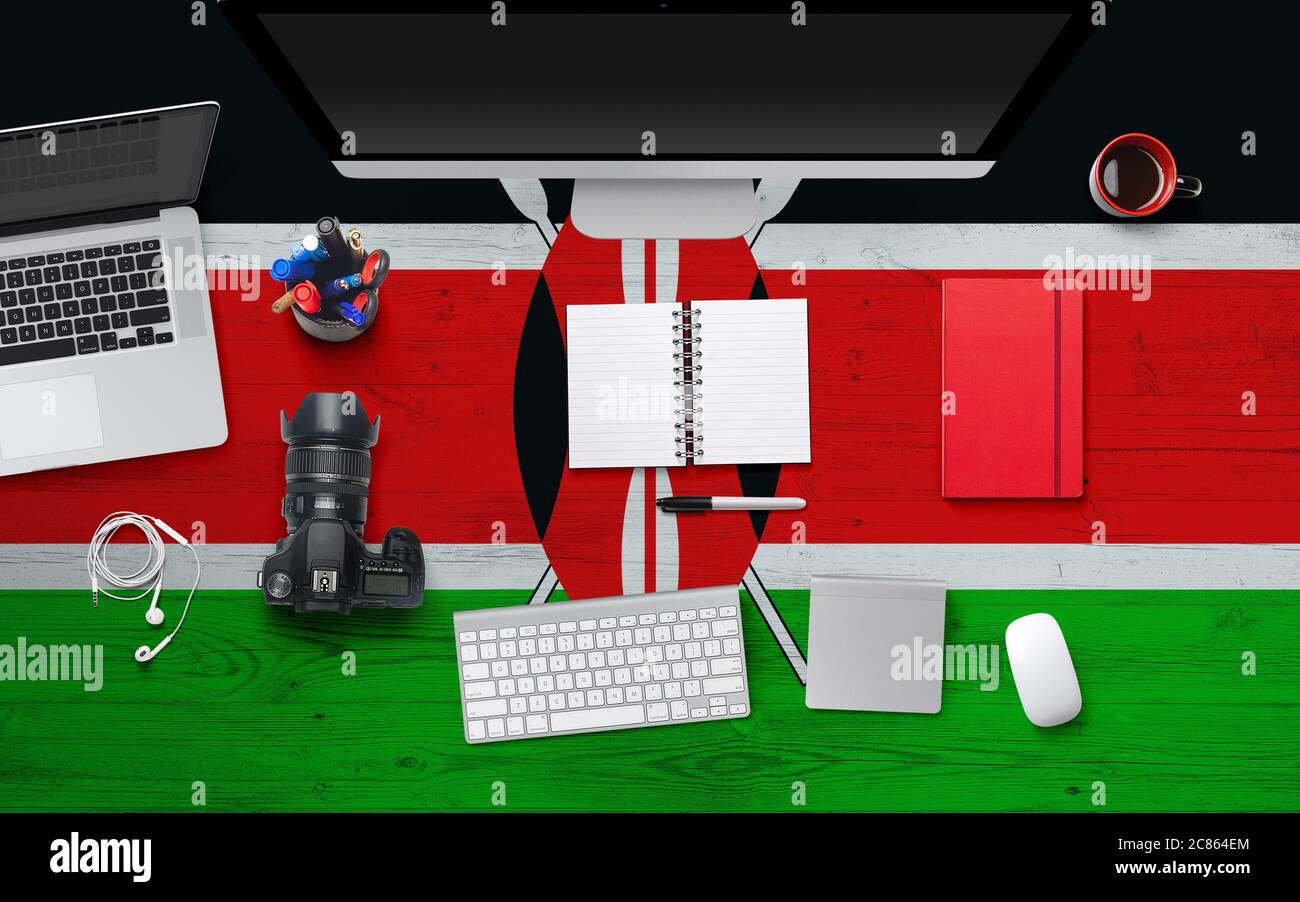 Kenya flag background with headphone,camera, notebook and mouse on ...