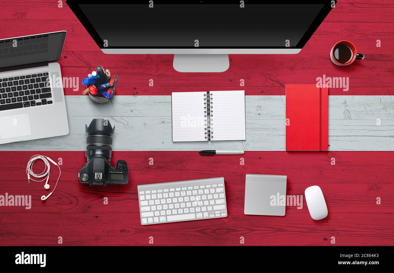 Latvia flag background with headphone,camera, notebook and mouse on ...