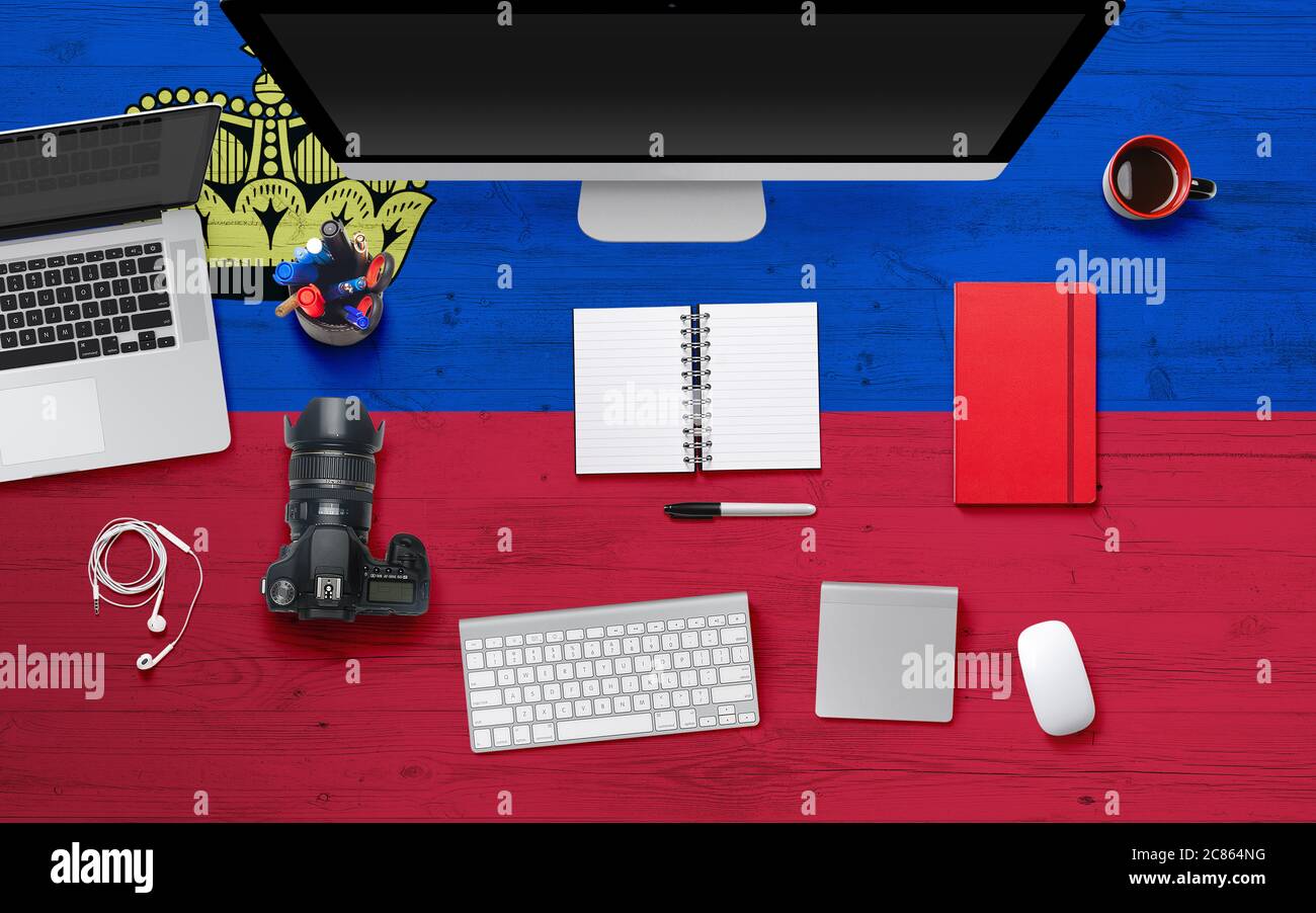 Liechtenstein flag background with headphone,camera, notebook and mouse ...