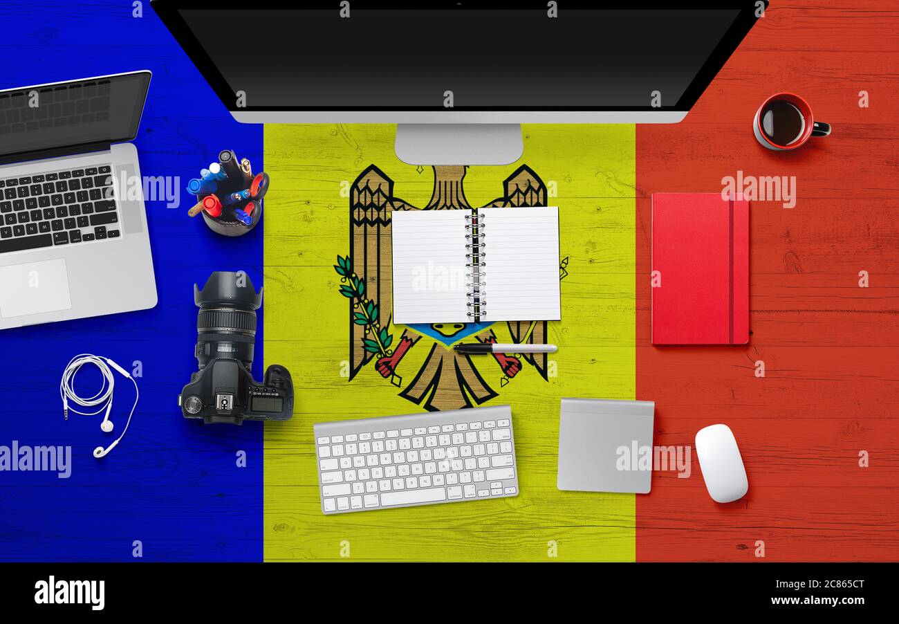 Moldova flag background with headphone,camera, notebook and mouse on ...