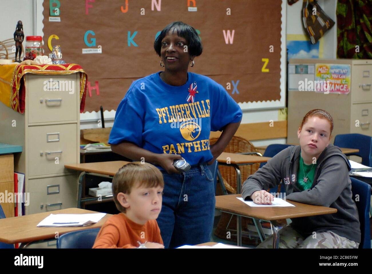 African-American sixth grade teacher in World Cultures classroom ...