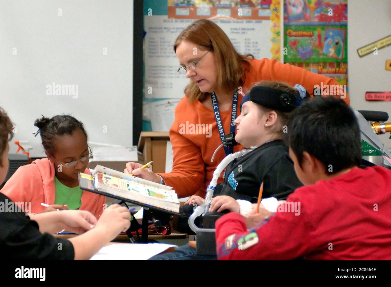 Pflugerville, Texas USA, November 2005: Teacher interacts with student ...