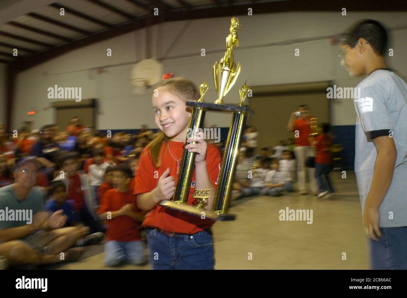 Edinburg, Texas USA, December 3, 2005: Young winner picks up her trophy ...