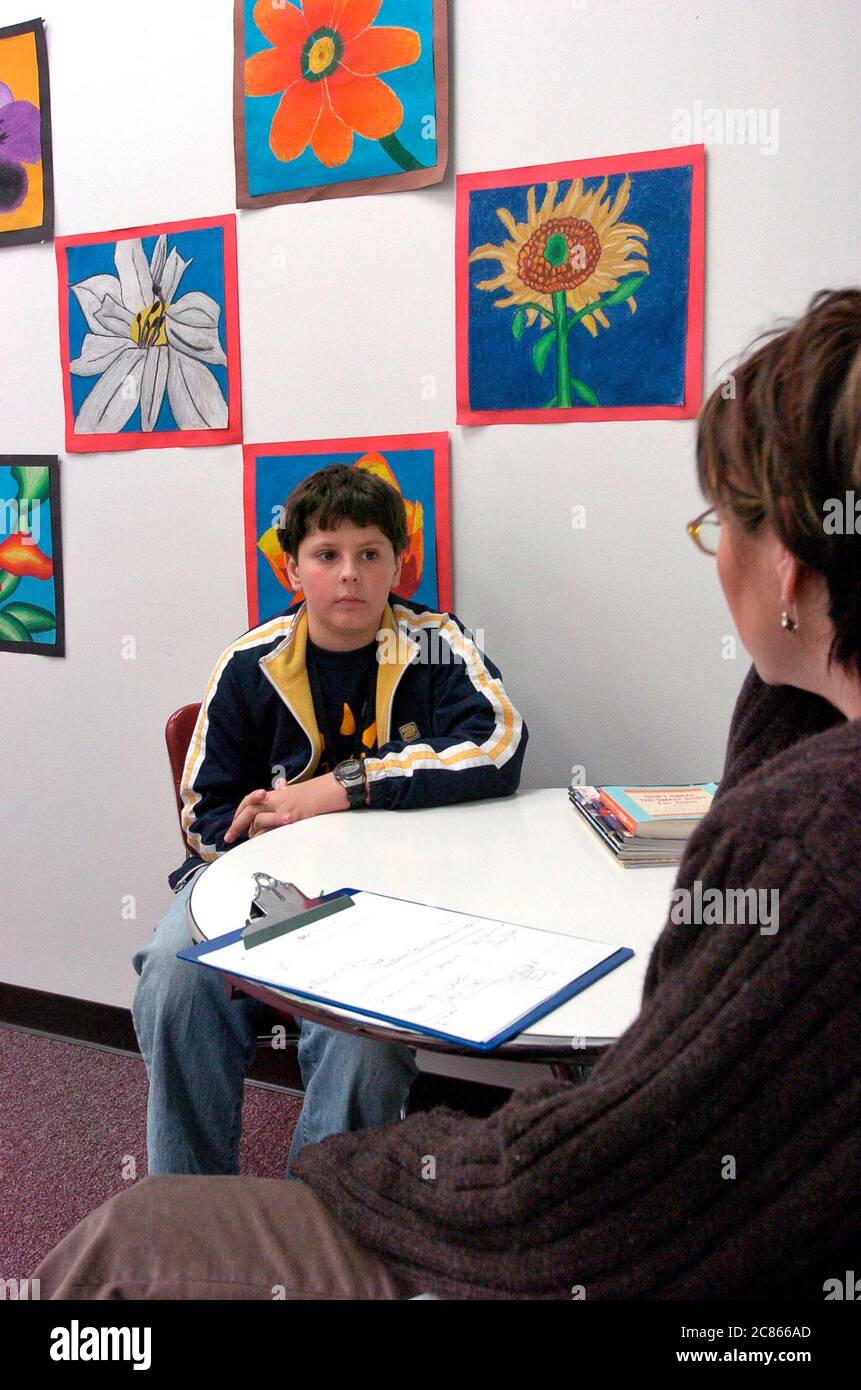 Austin, Texas USA, 2005: Sixth grade middle school student talks with ...