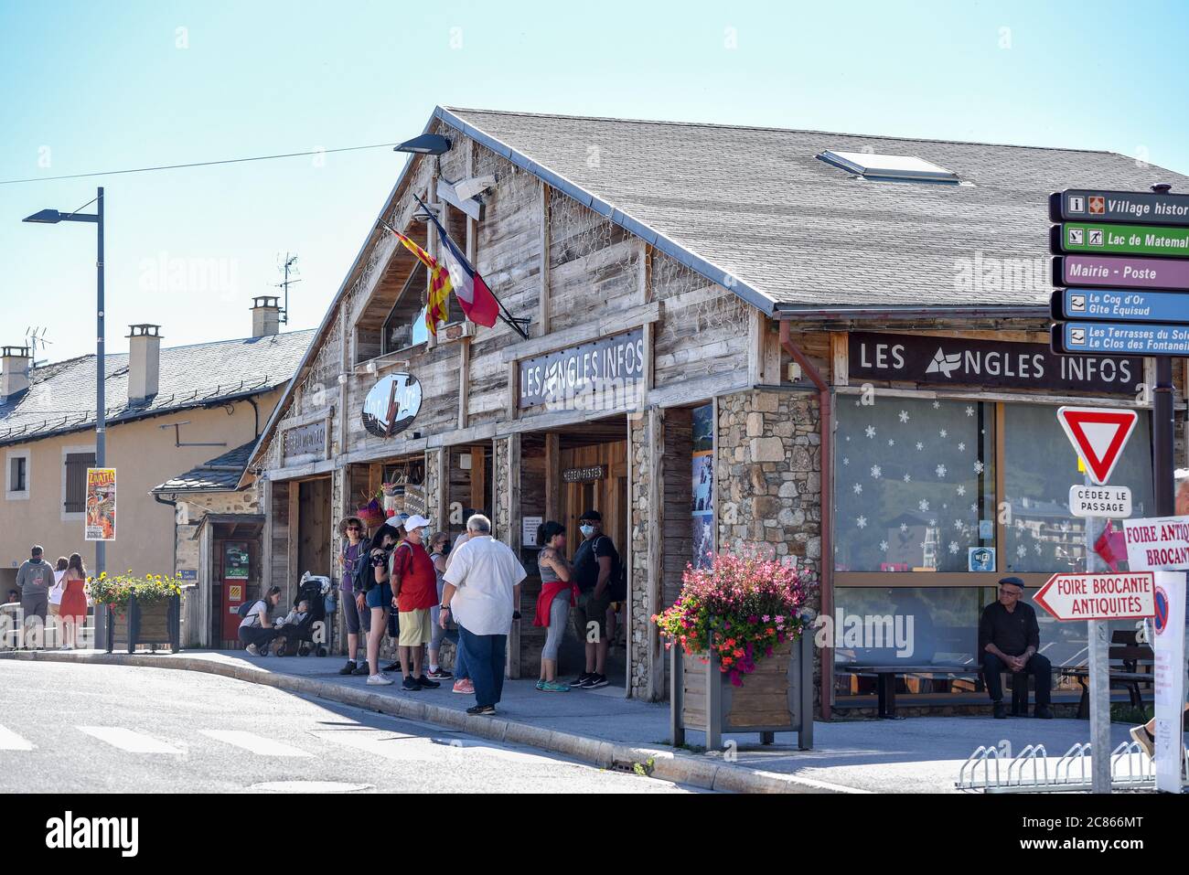 Les Angles, France : 2020 July 19 : People wait in Tourism Ofiice in ...