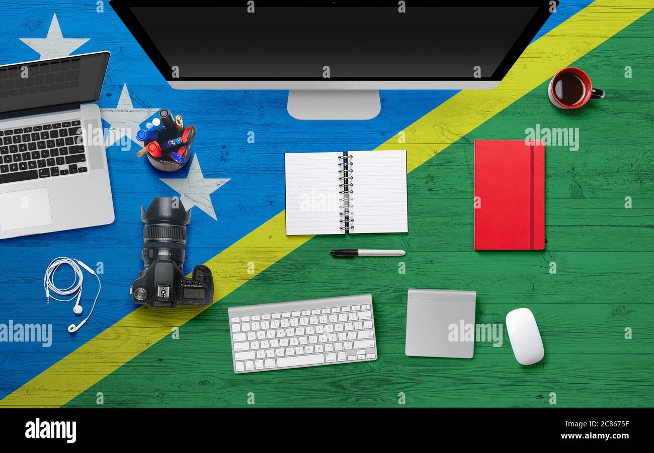 Solomon Islands flag background with headphone,camera, notebook and ...
