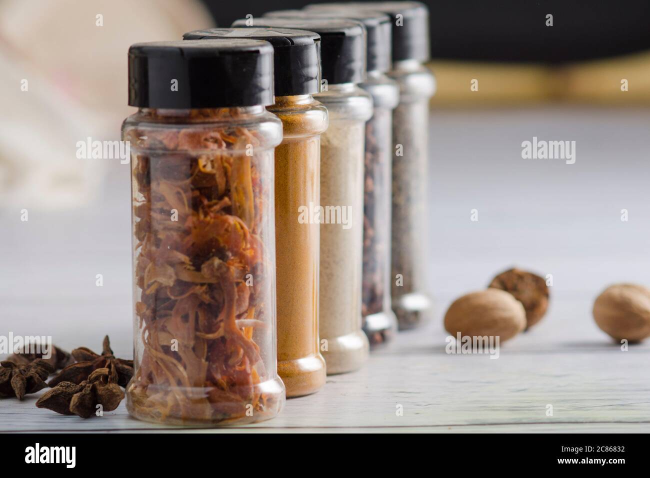 Mace, Turmeric, white pepper, Black pepper spices in plastic condiment ...