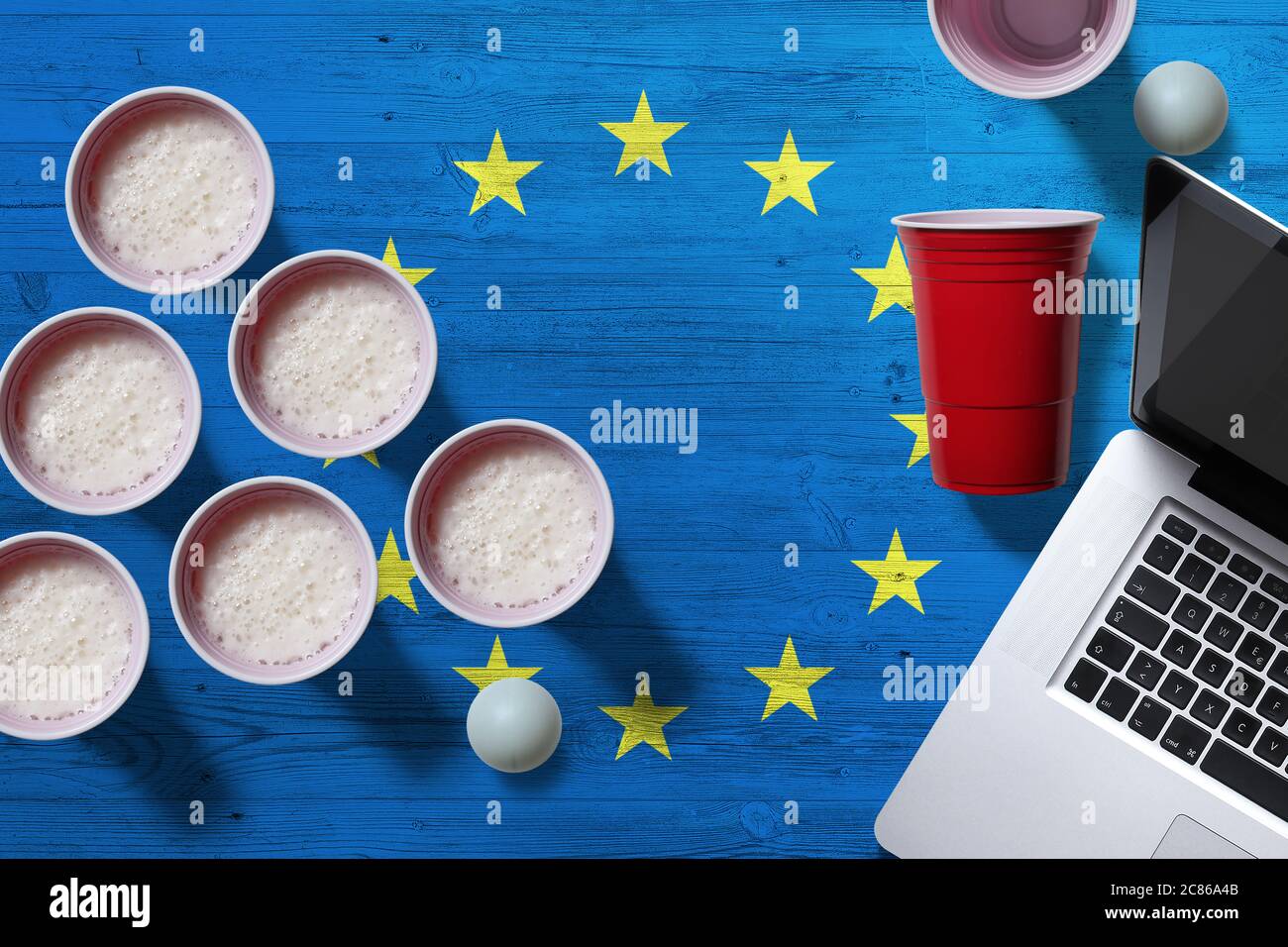 European Union flag concept with plastic beer pong cups and laptop on ...