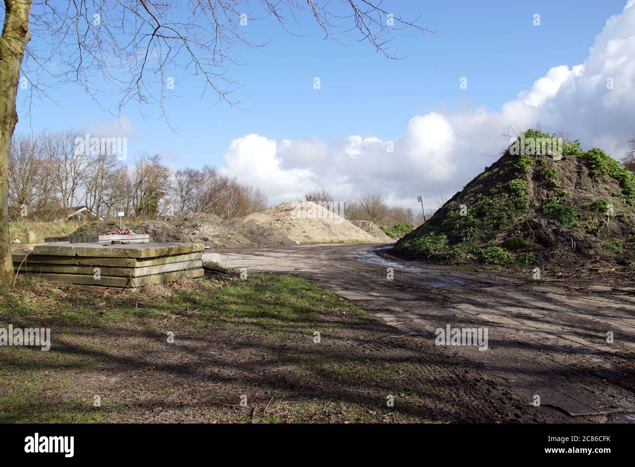 Sand and soil storage: Sand piles, a soil pile and a stack of tiles in ...