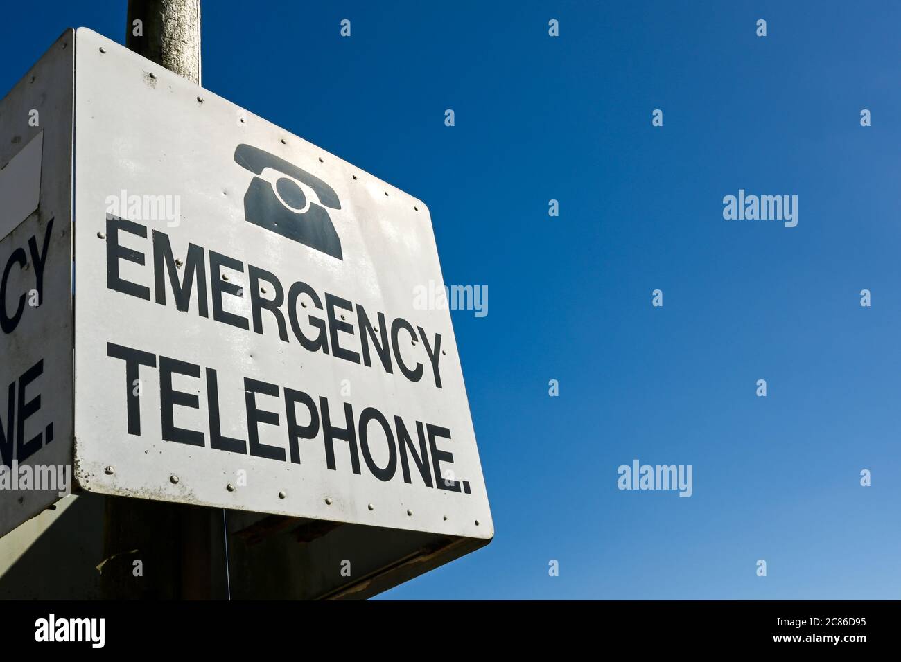 Large sign showing the location of an emergency telephone at a coastal ...
