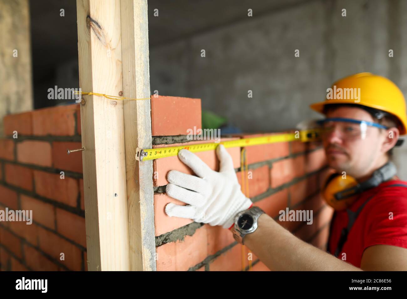 Builder using special tools Stock Photo - Alamy