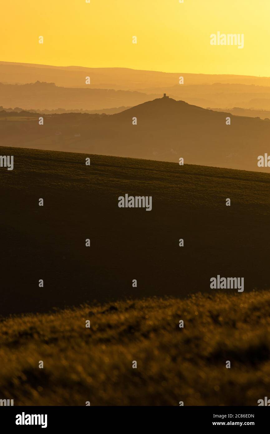 Sunset layers in the landscape with views to Brentor church on Dartmoor ...