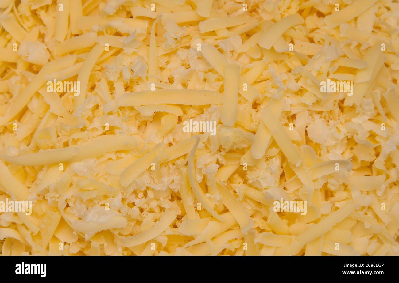 Closeup texture of a yellow grated cheese Stock Photo - Alamy