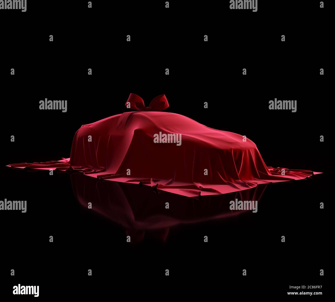 Luxury car prize covered with premium fabric on a black background. Red ...