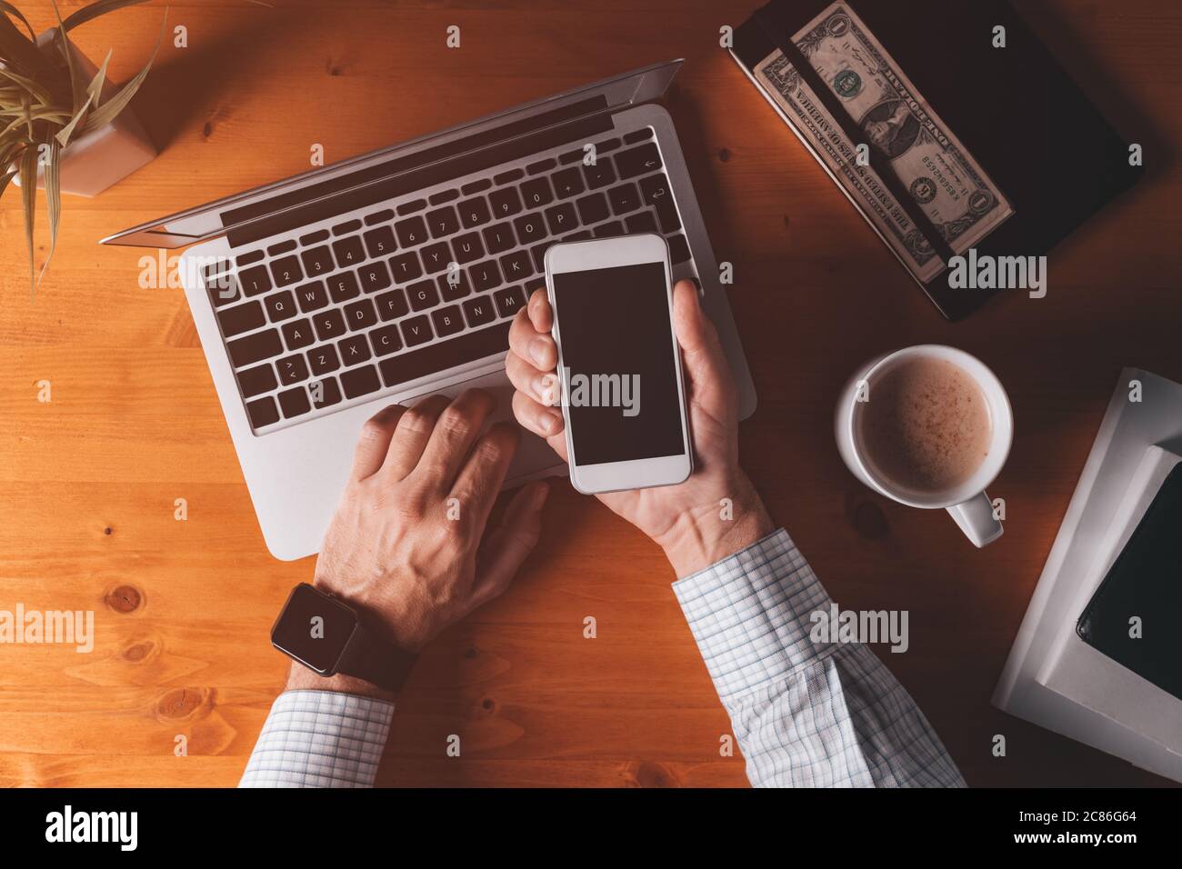 Smartphone mock up overhead shot, businessman holding mobile phone with ...