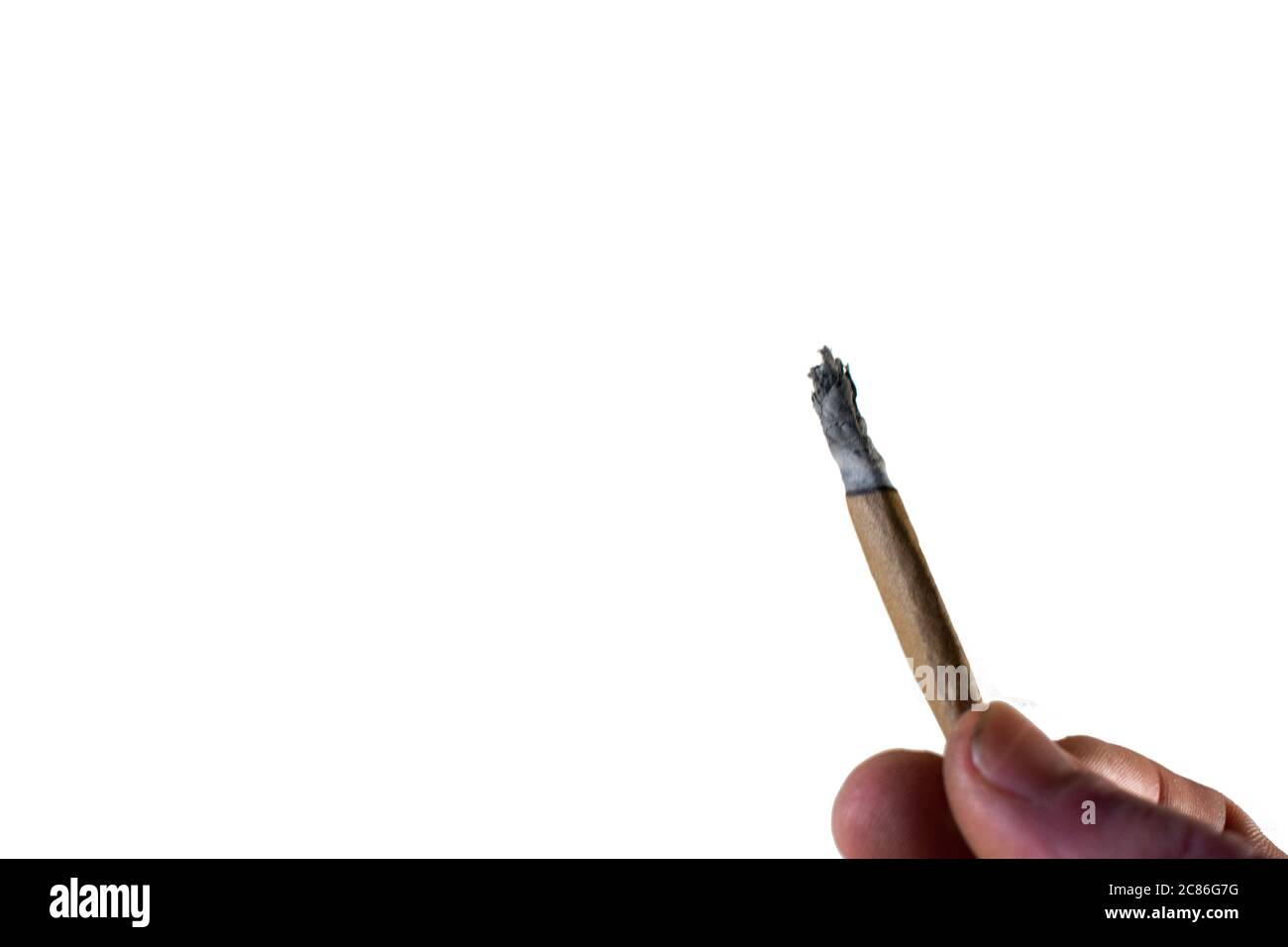 A Man Holding a Rolled Marijuana Cigar With a Piece of Ash on Top on a ...