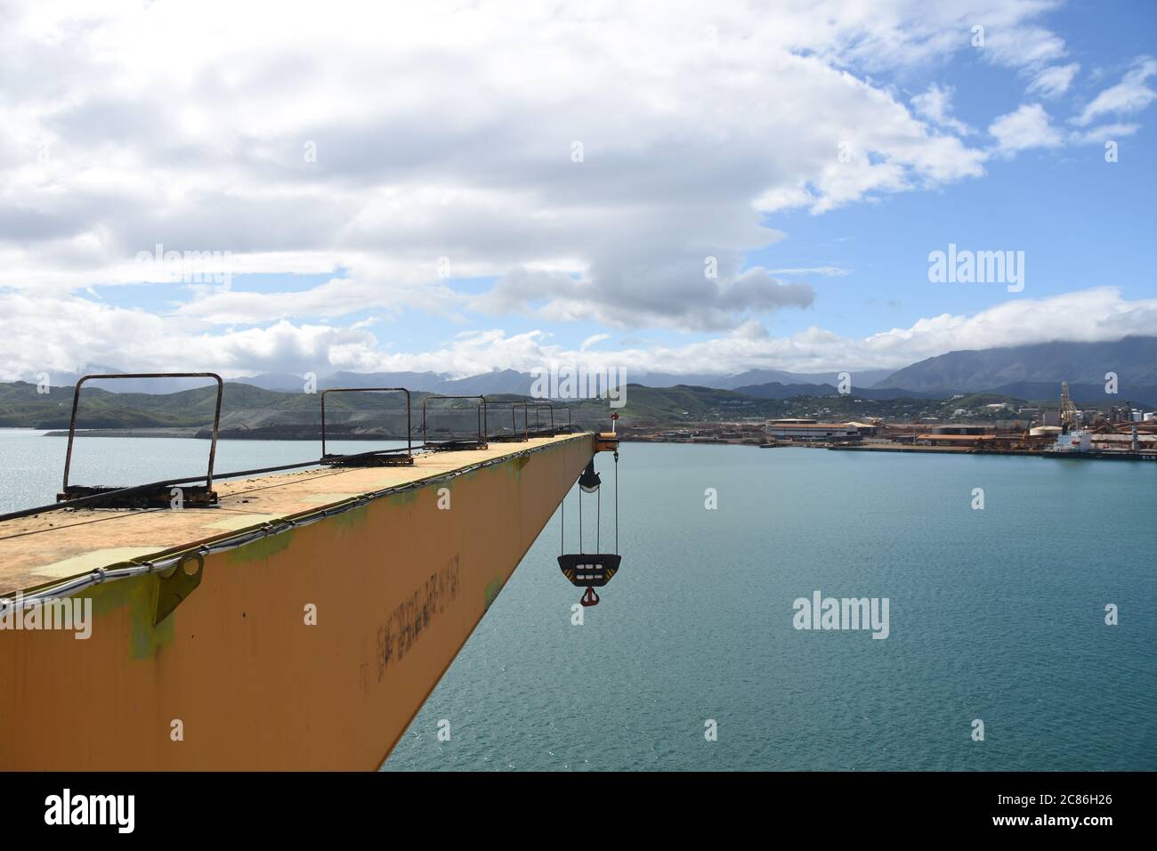 View from the top on jib with hook of a crane in a merchant cargo ...