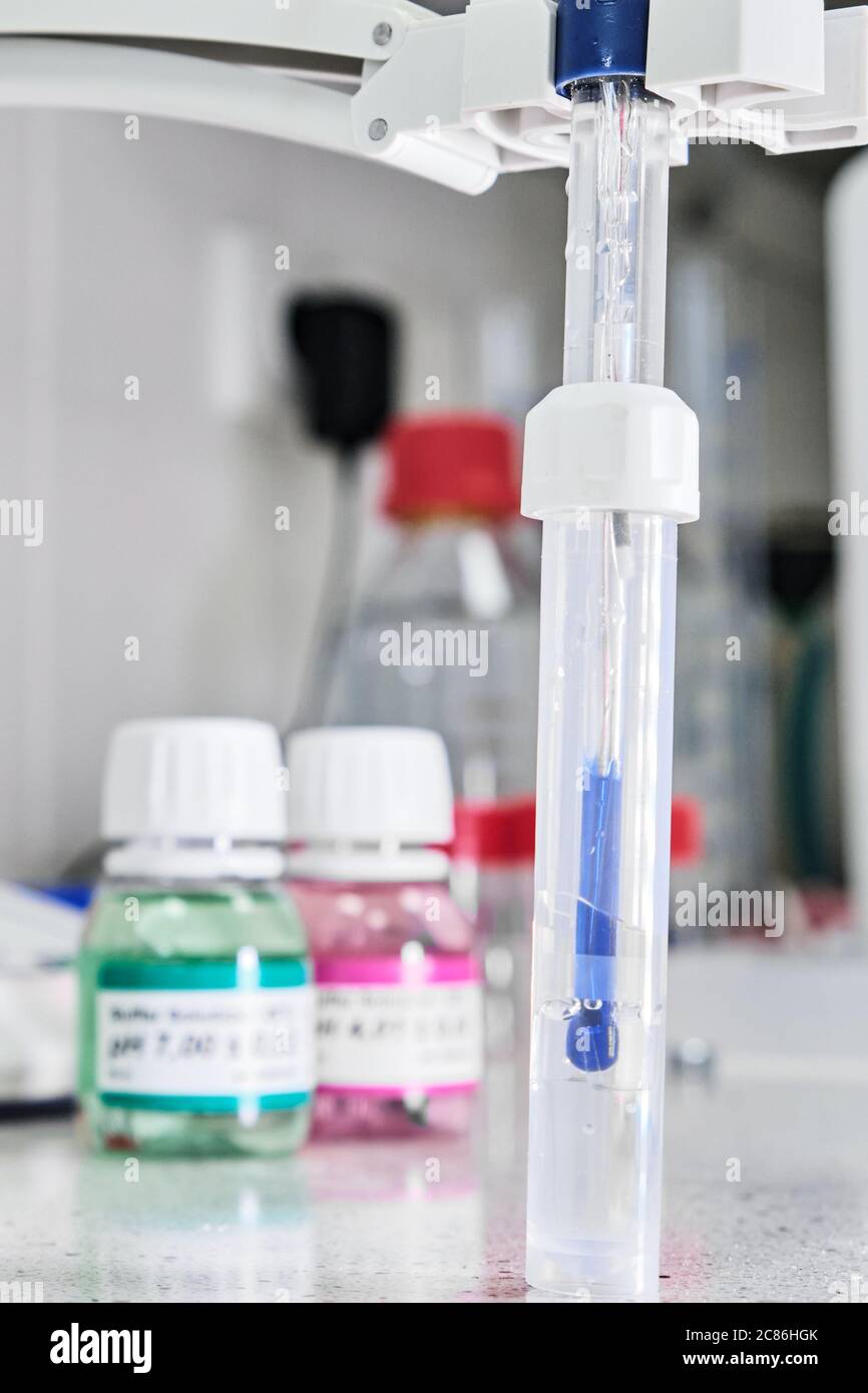 pH meter with glass electrode for measuring of alkalinity and acidity with calibration solution ...