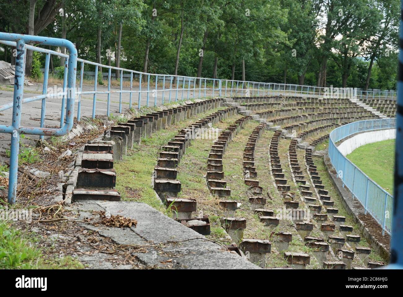 A football stadium tribune in disrepair or decayed in a provincial town ...