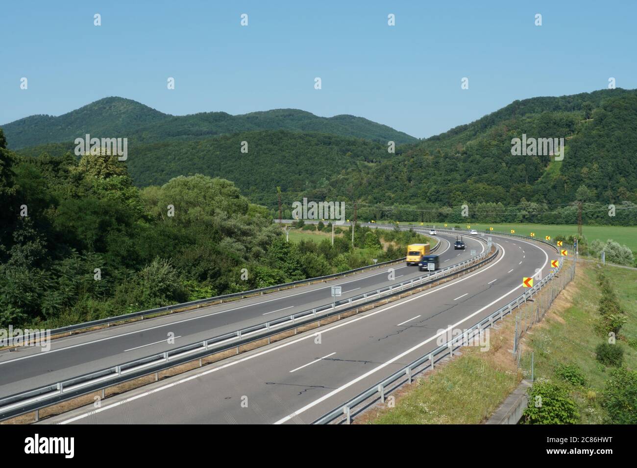 A highway in Slovakia leading among mountainous country. The highway is ...