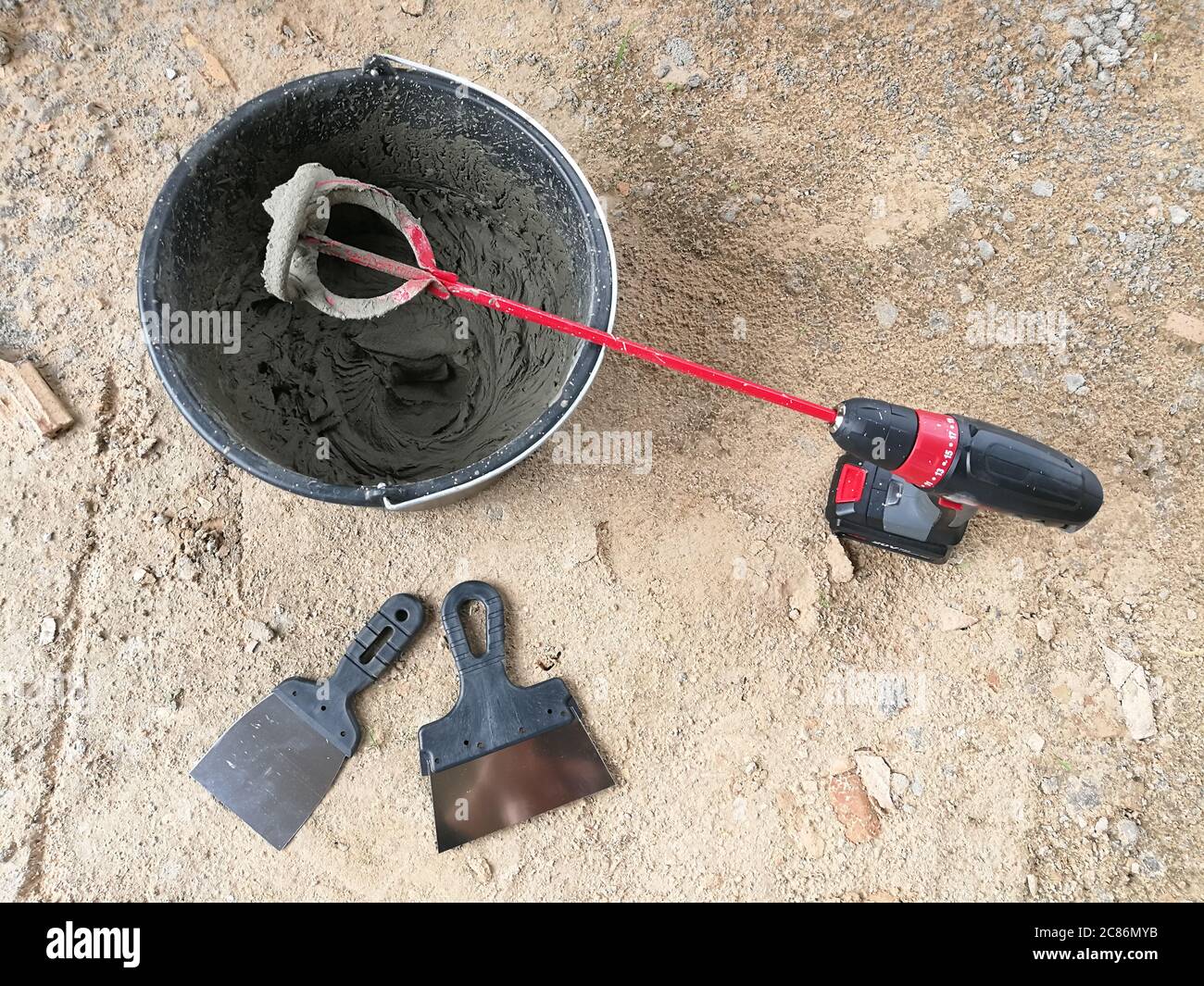 Drill glue mixer mixing construction glues in construction site Stock ...