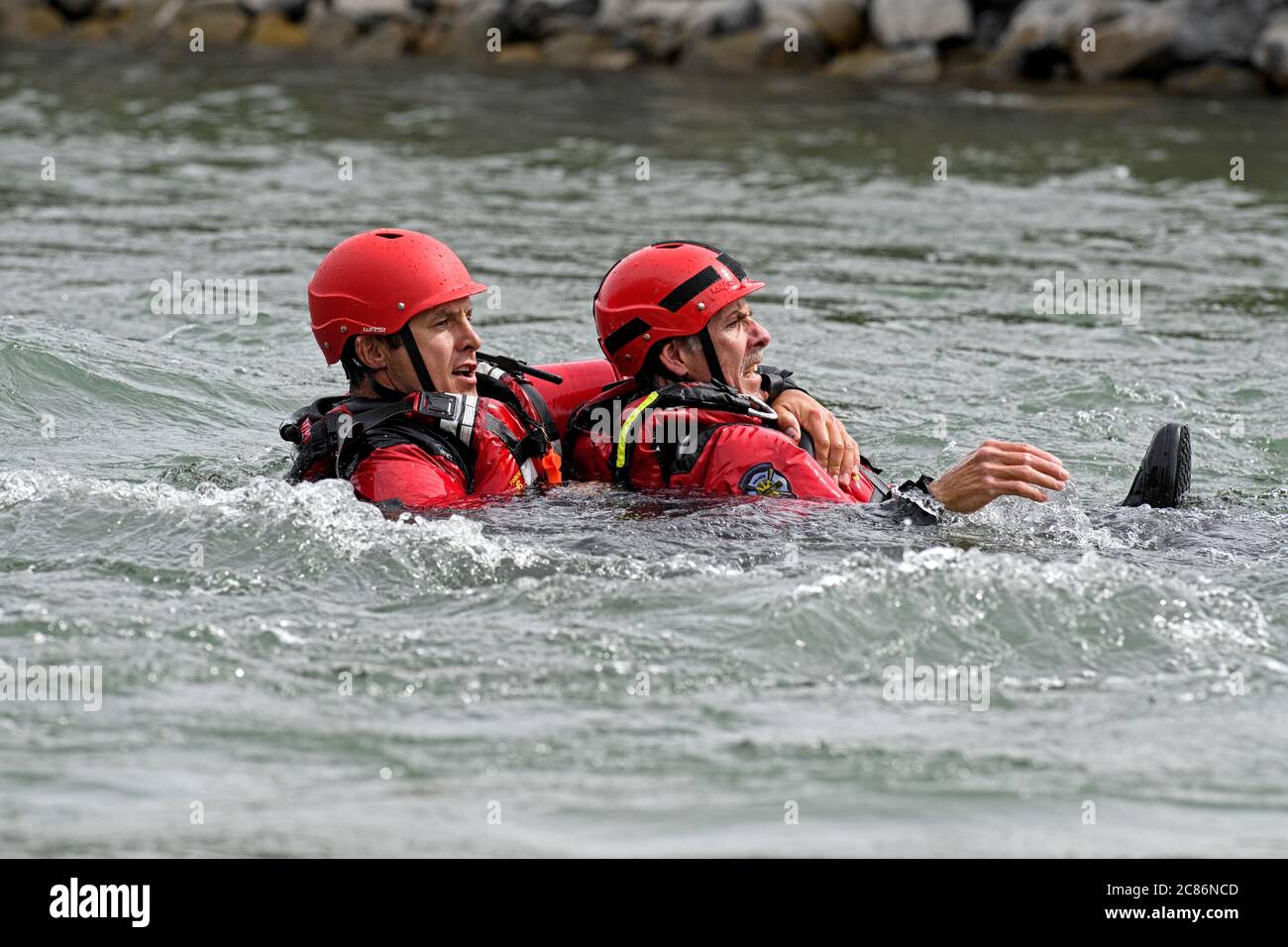 Team members of the Calgary Fire Department Rescue Squad practicing river recovery techniques on ...
