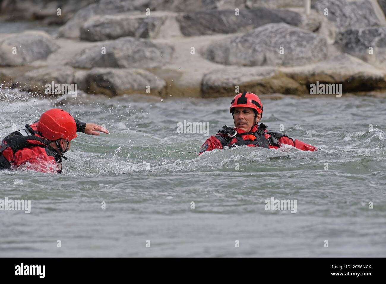 Team members of the Calgary Fire Department Rescue Squad practicing river recovery techniques on ...