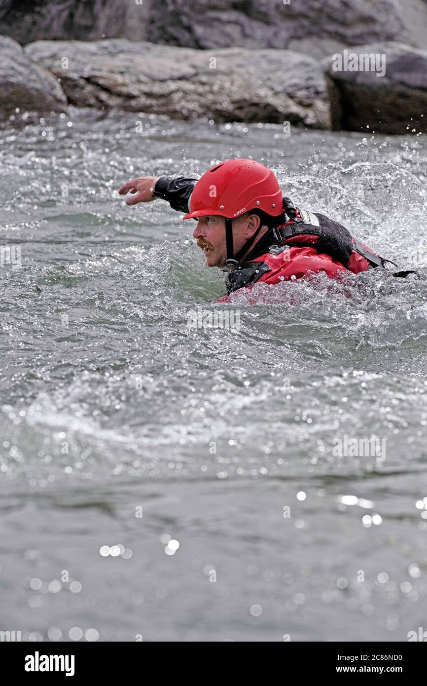 Team member of the Calgary Fire Department Rescue Squad practicing river recovery techniques on ...
