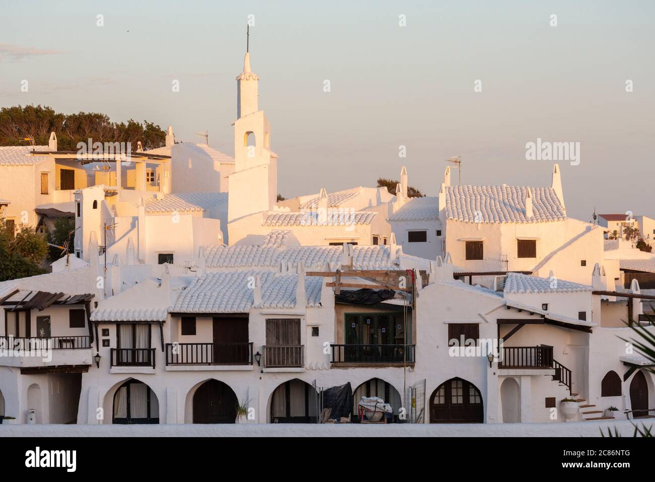 The whitewash fishing village of Binibeca Vell at sunset, Menorca Stock ...